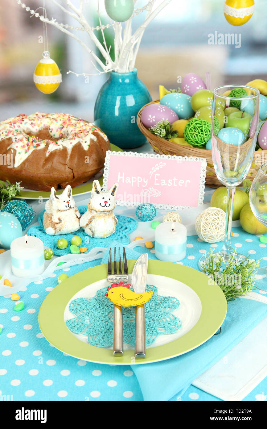 Serving Easter table on room background Stock Photo - Alamy