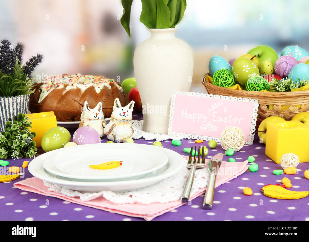 Serving Easter table on room background Stock Photo - Alamy