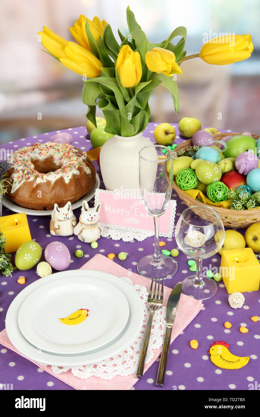 Serving Easter table on room background Stock Photo - Alamy