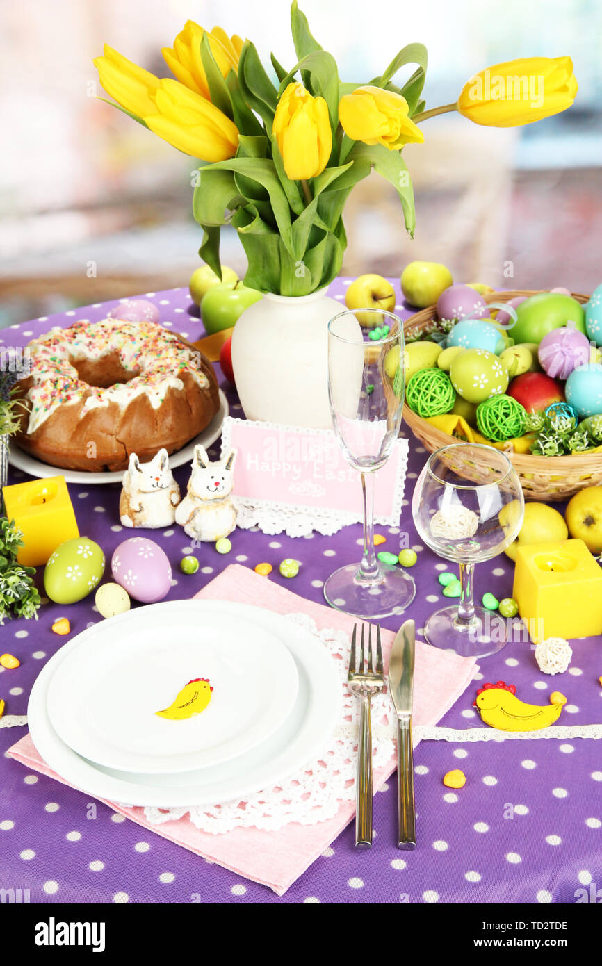 Serving Easter table on room background Stock Photo - Alamy