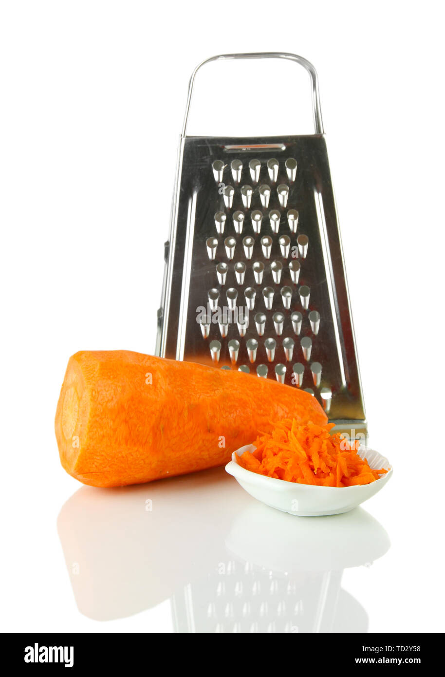 Metal grater and carrot, close up, isolated on white Stock Photo - Alamy