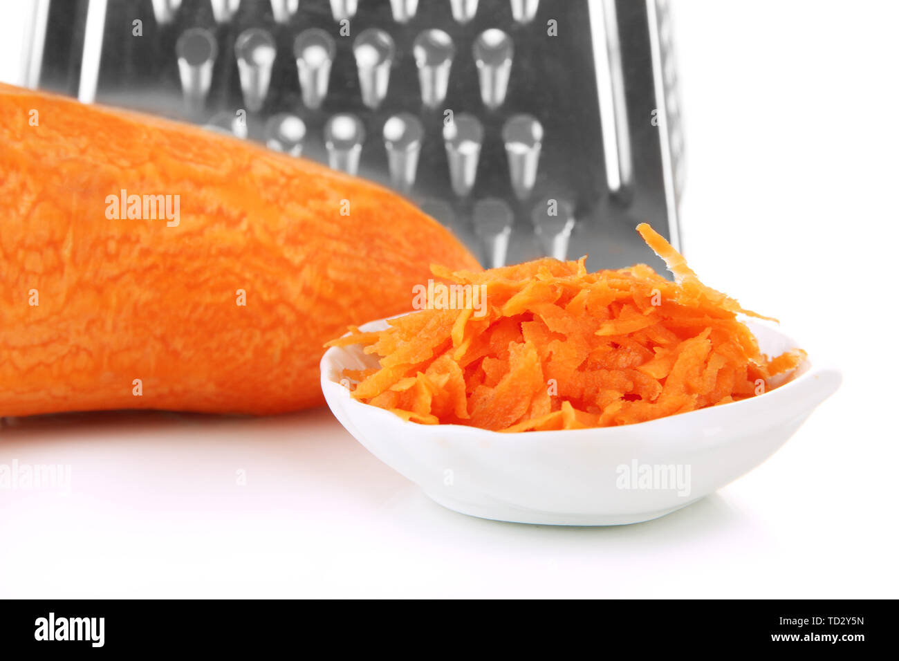 Metal grater and carrot, close up, isolated on white Stock Photo - Alamy