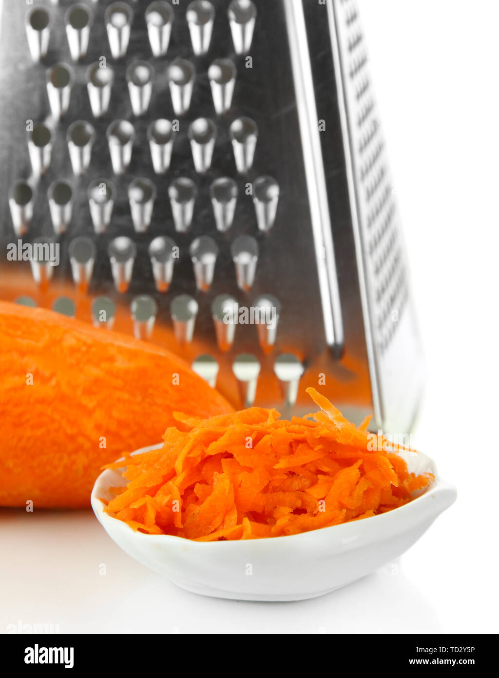 Metal grater and carrot, close up, isolated on white Stock Photo - Alamy