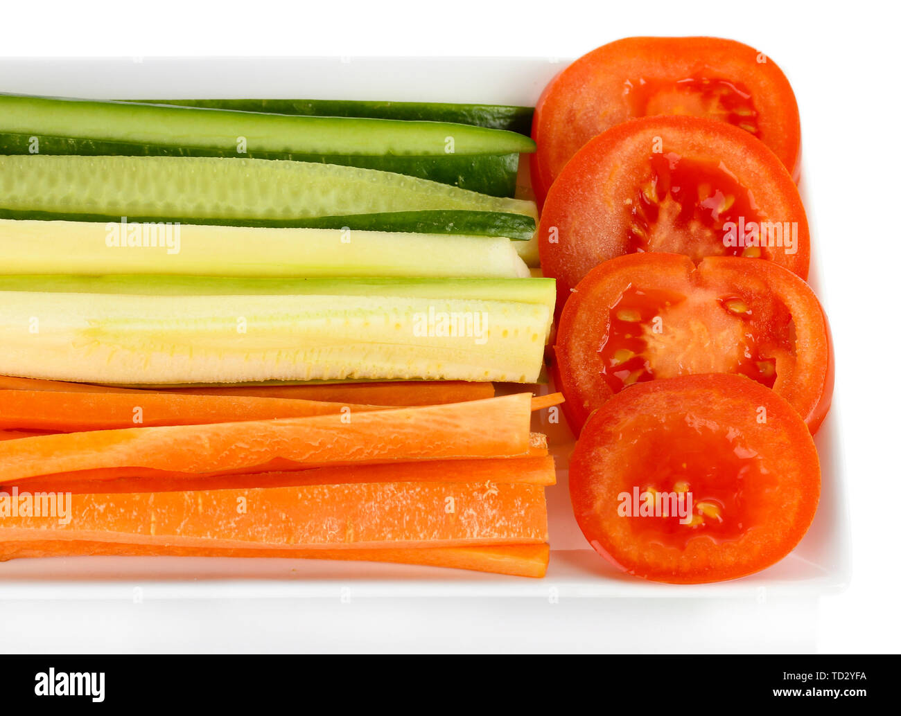 Assorted raw vegetables sticks in plate isolated on white Stock Photo ...