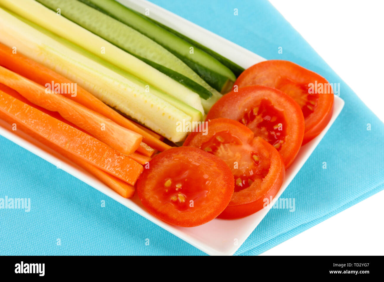 Assorted raw vegetables sticks in plate isolated on white Stock Photo ...