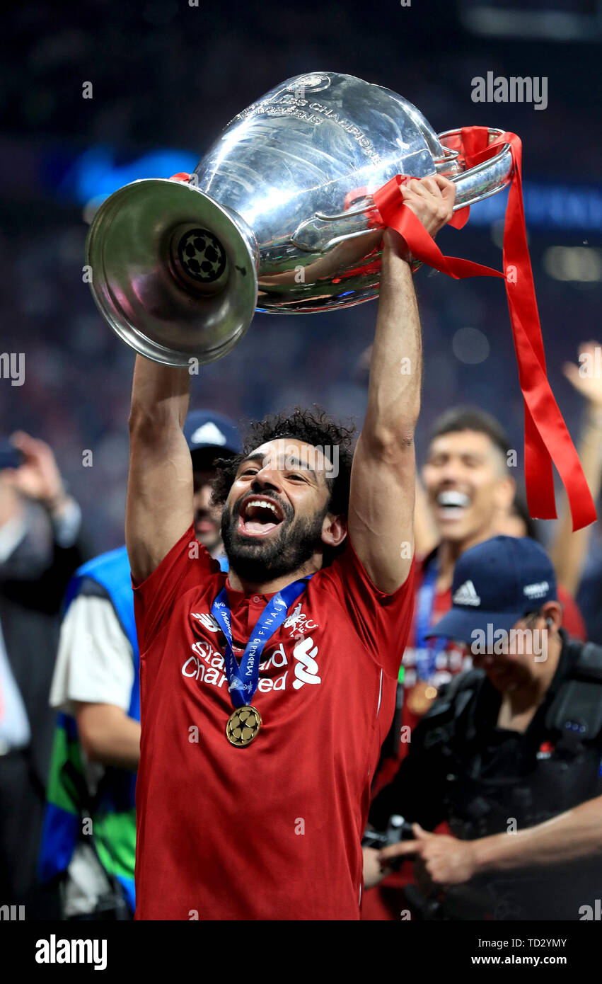 Liverpool's Mohamed Salah celebrates with the trophy after the UEFA ...