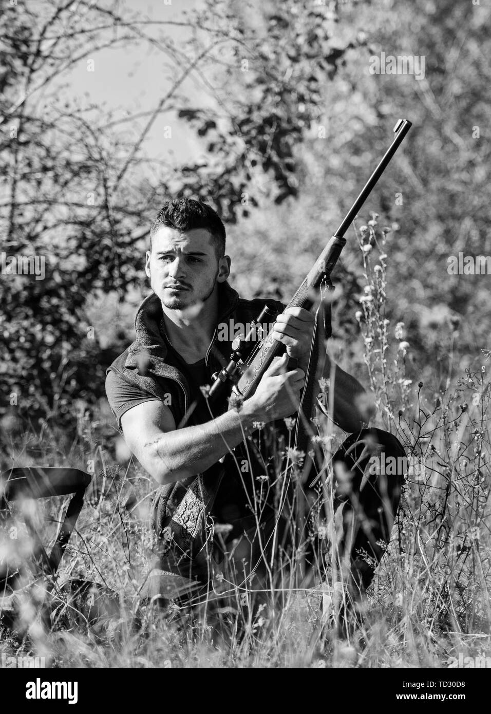 Hunter with rifle ready to hunting nature background. Hunting skills ...