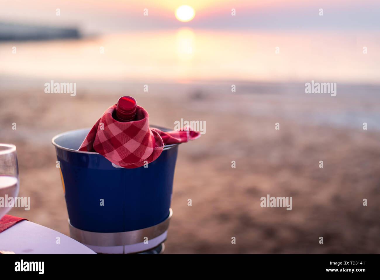 Bottle of wine chilled on a beach for a romantic dinner Stock Photo - Alamy