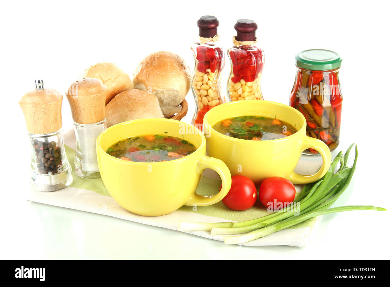 Fragrant soup in cups isolated on white Stock Photo - Alamy