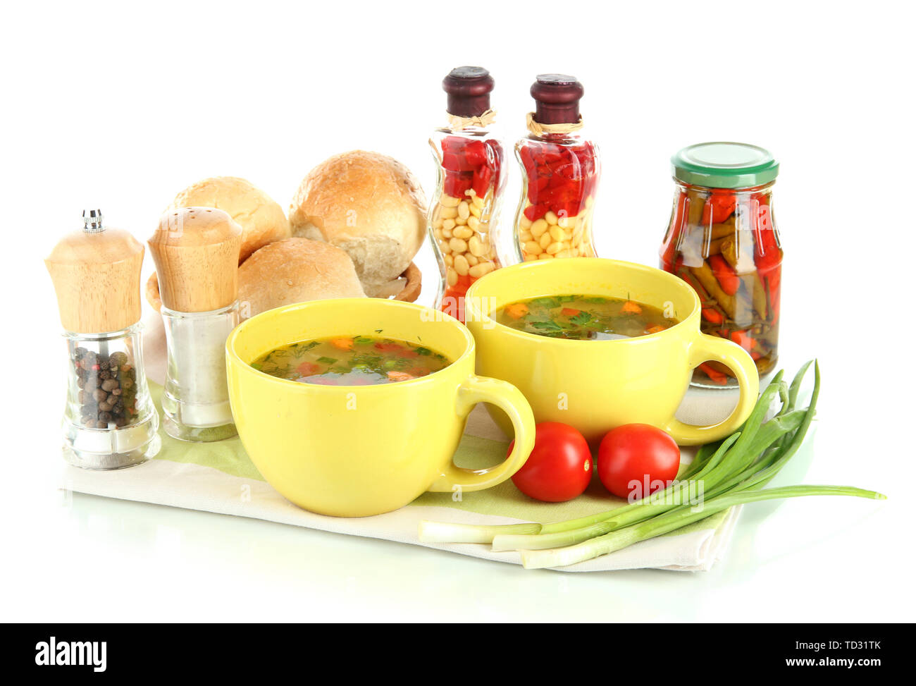 Fragrant soup in cups isolated on white Stock Photo - Alamy