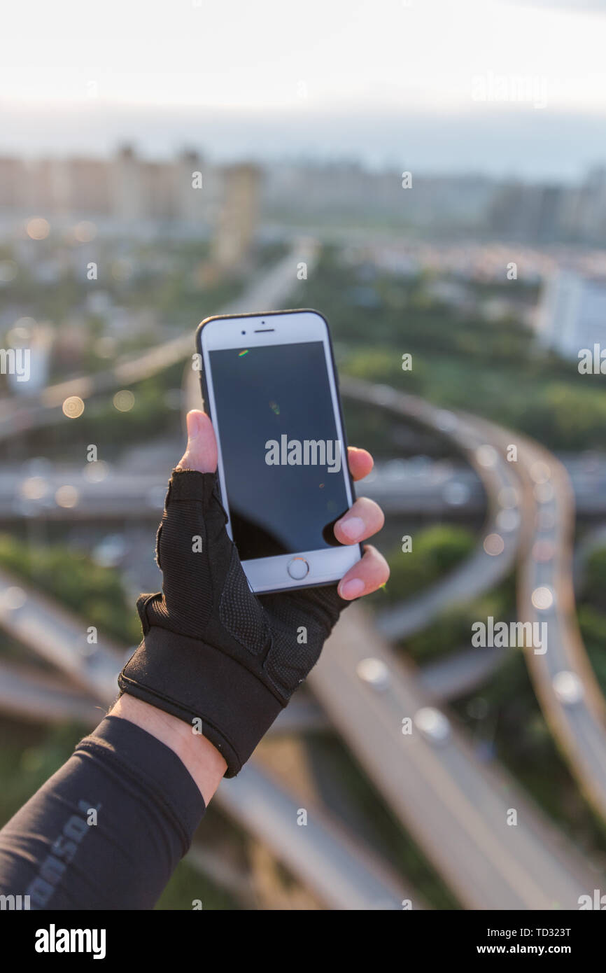 Cell phone in hand Stock Photo - Alamy