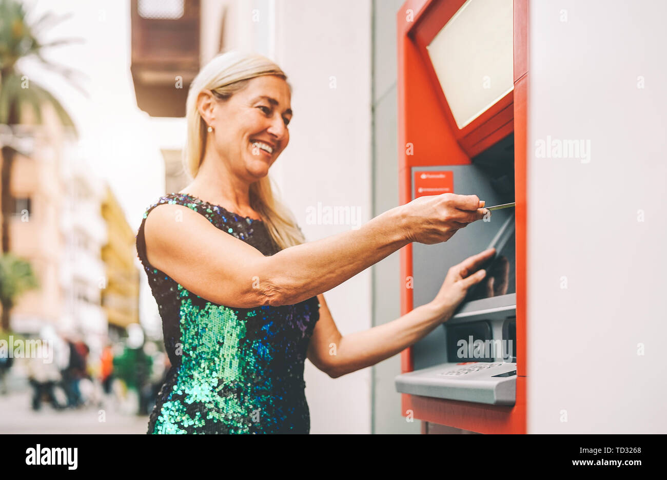 Mature woman money holiday hi-res stock photography and images - Alamy