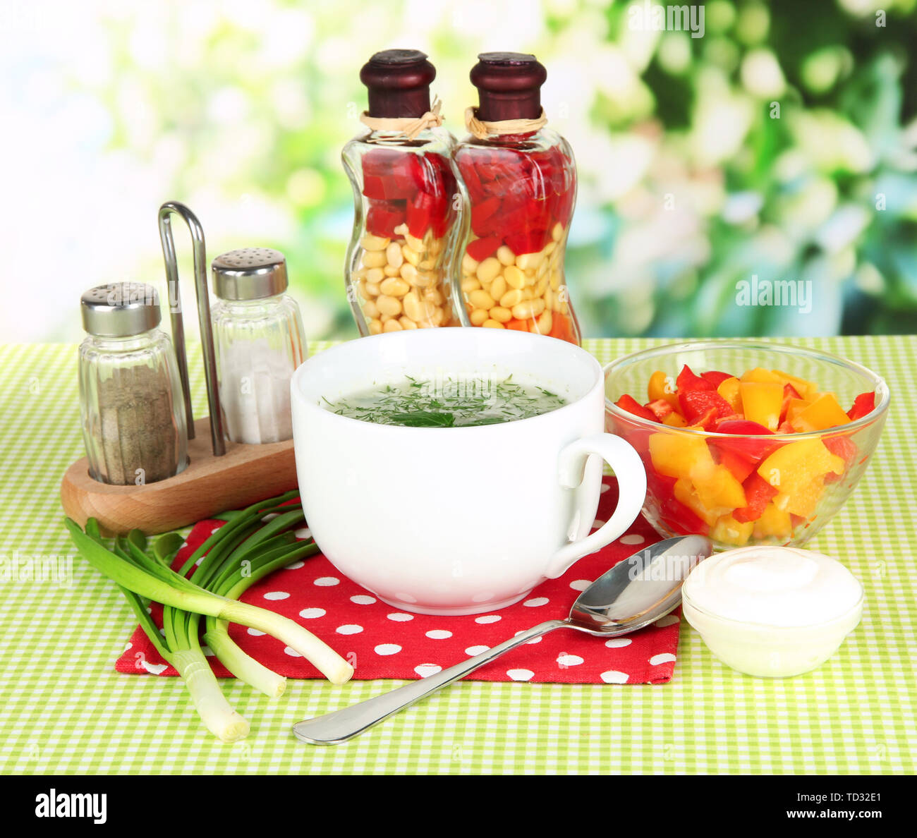 Fragrant soup in cup on table in garden Stock Photo - Alamy