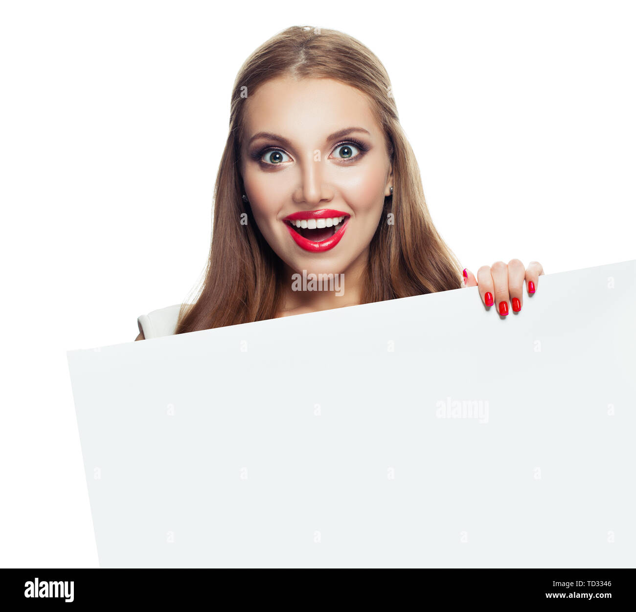 Surprised model woman holding white empty paper signboard isolated on ...