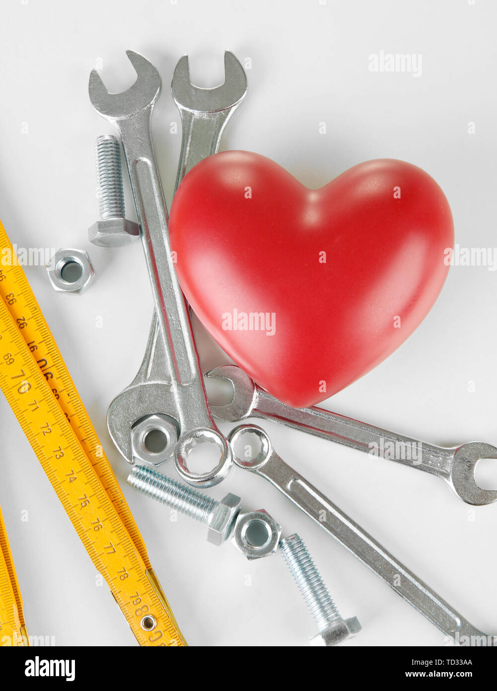 Heart and tools. Concept: Renovation of heart. Isolated on white Stock ...