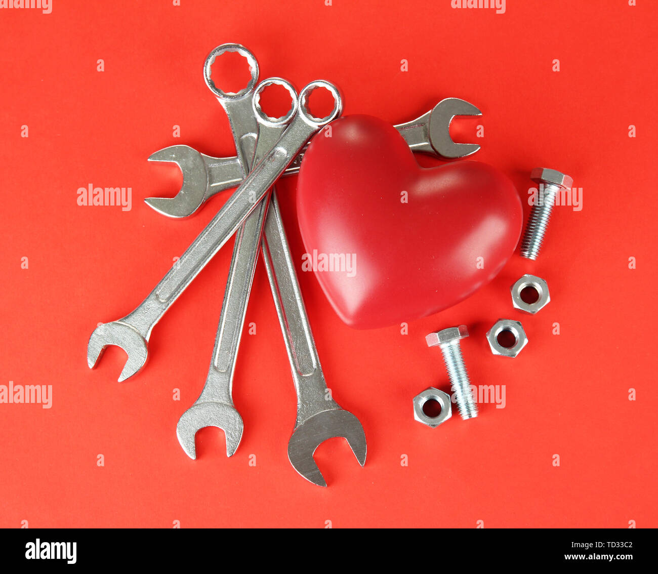 Heart and tools. Concept: Renovation of heart. On color background ...
