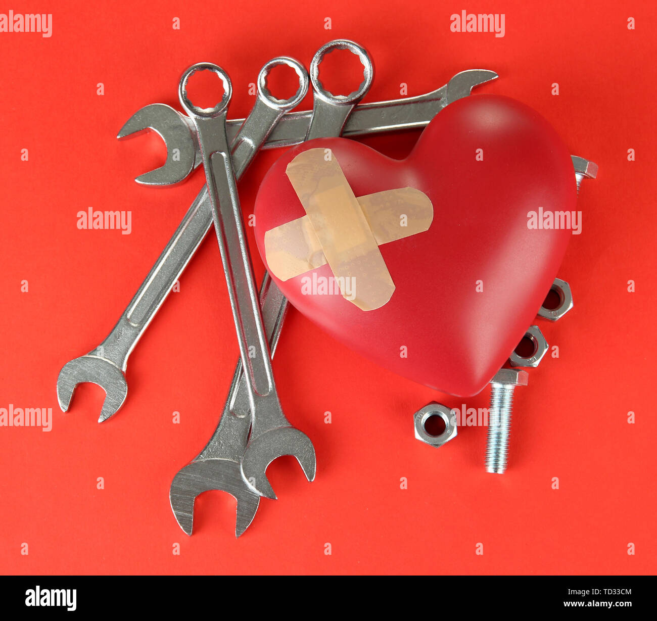 Heart and tools. Concept: Renovation of heart. On color background ...