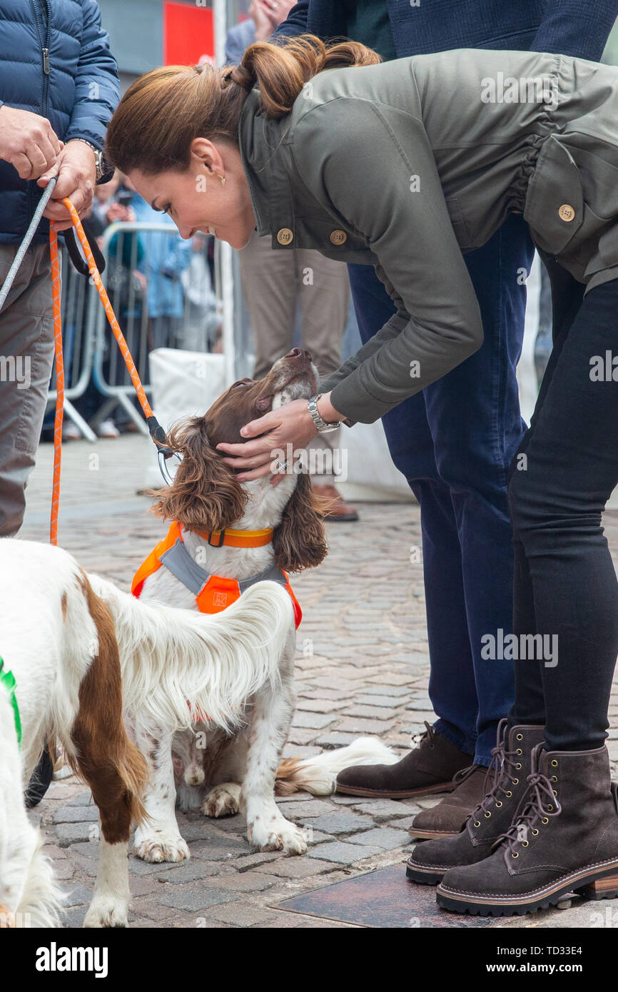 The Duchess of Cambridge meets three dogs Max, Paddy, and Harry, as she ...
