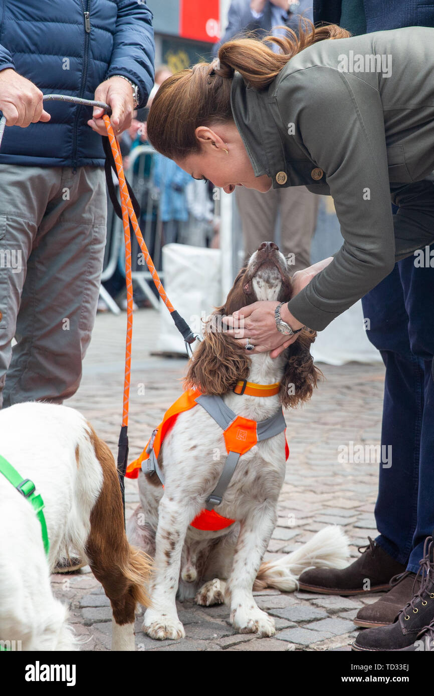 The Duchess of Cambridge meets three dogs Max, Paddy, and Harry, as she ...