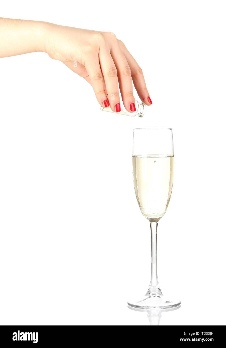 Pour something into glass with drink isolated on white Stock Photo - Alamy