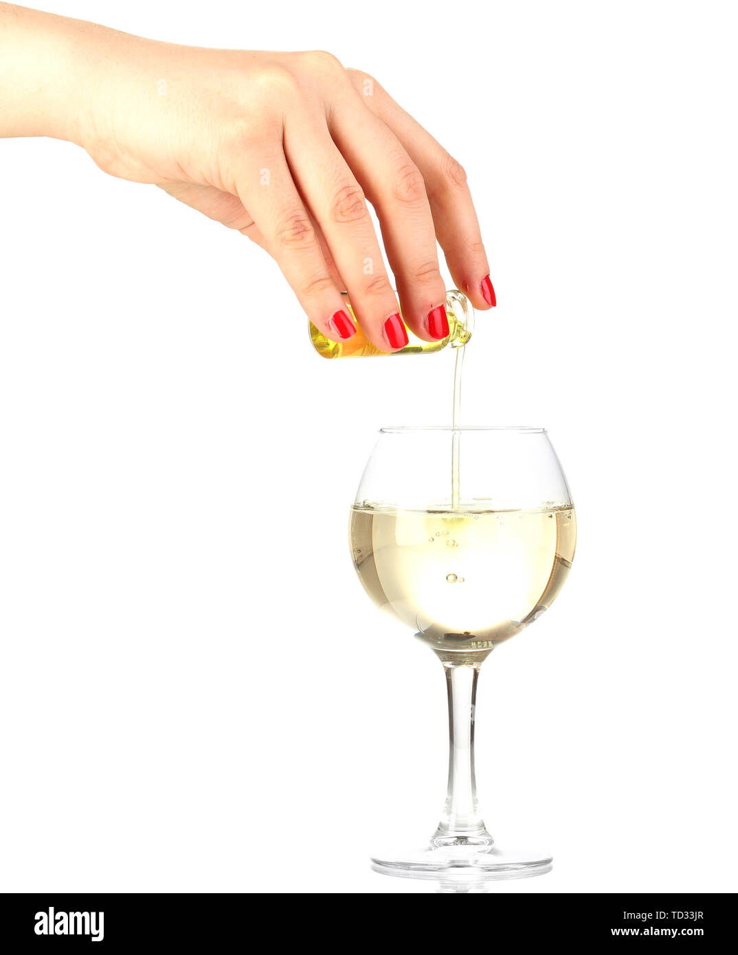 Pour something into glass with drink isolated on white Stock Photo - Alamy