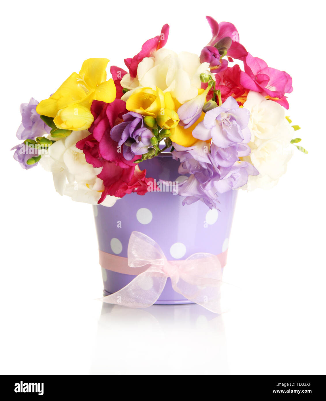 Beautiful bouquet of freesias in pail, isolated on white Stock Photo ...