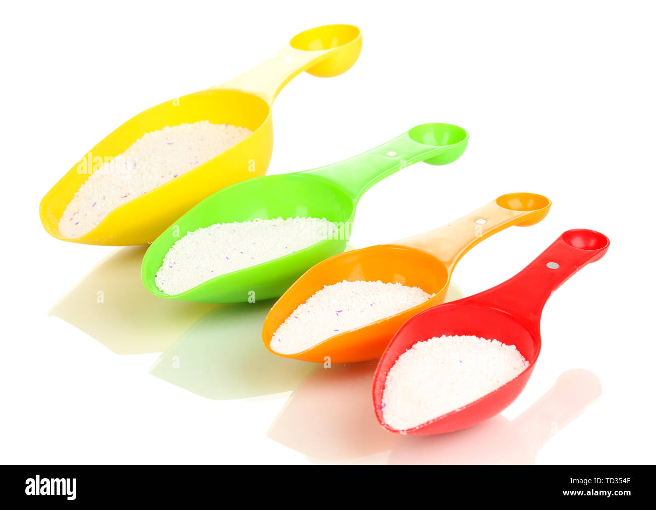 Washing powder in measuring cup isolated on white Stock Photo - Alamy
