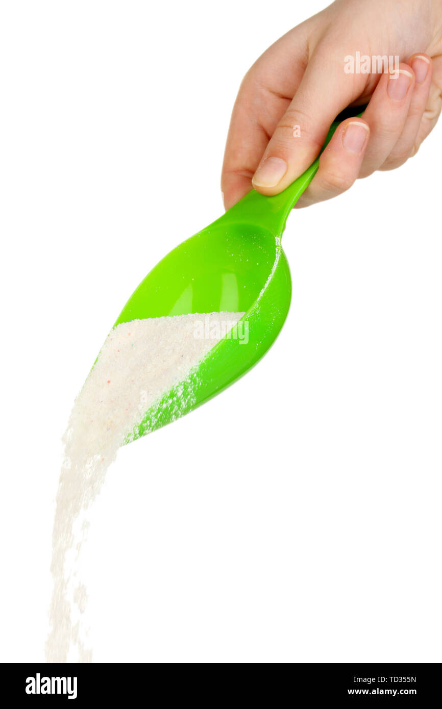 Measuring cup with washing powder in hand isolated on white Stock Photo ...