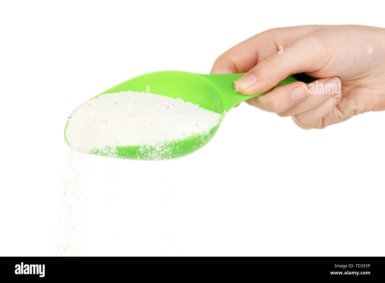 Measuring cup with washing powder in hand isolated on white Stock Photo ...