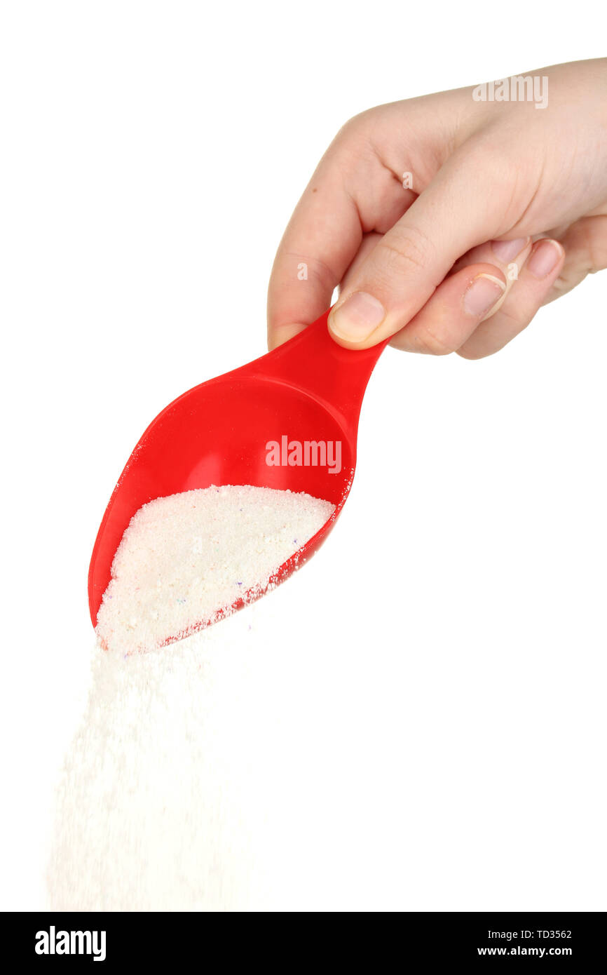 Measuring cup with washing powder in hand isolated on white Stock Photo ...