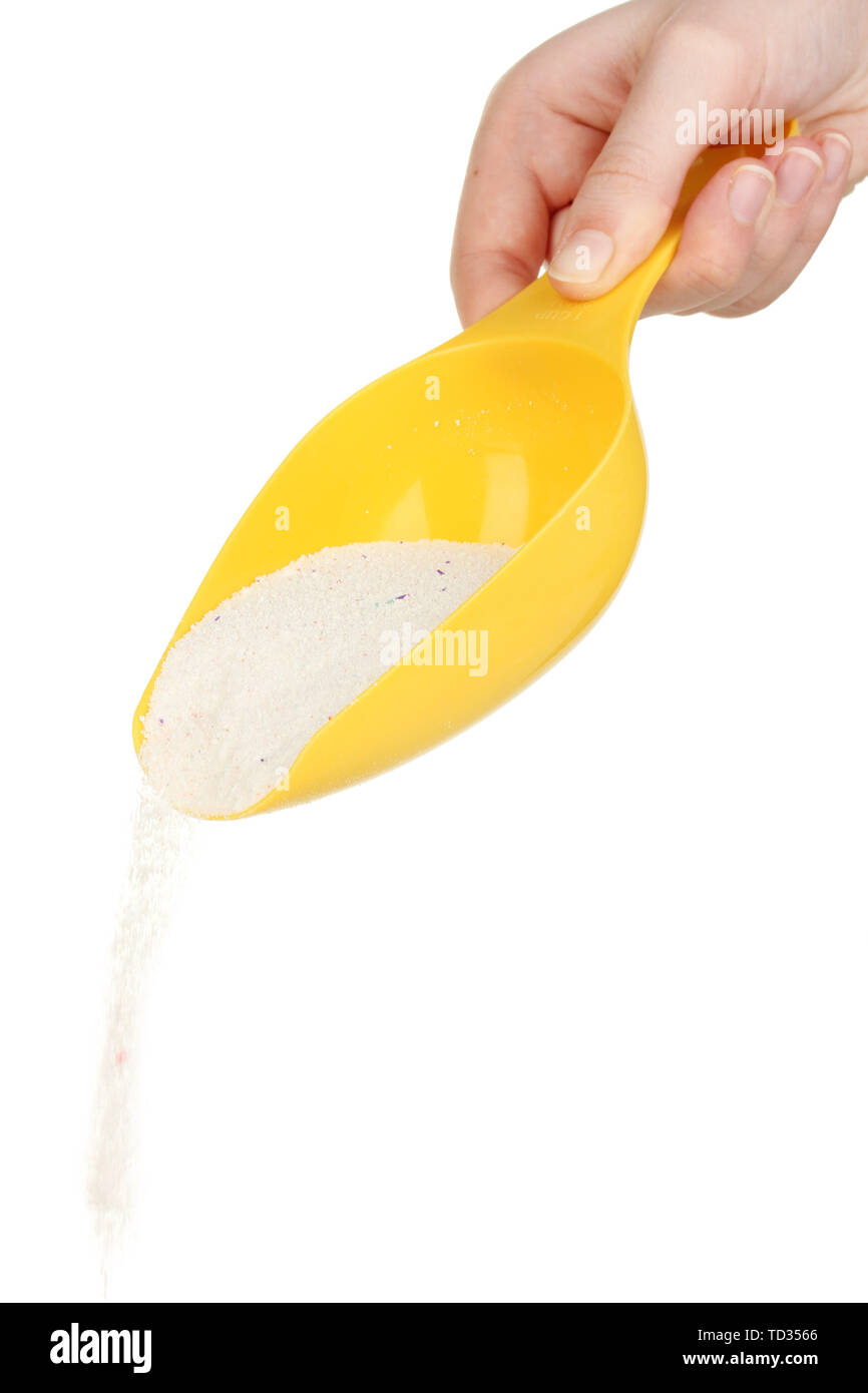 Measuring cup with washing powder in hand isolated on white Stock Photo ...