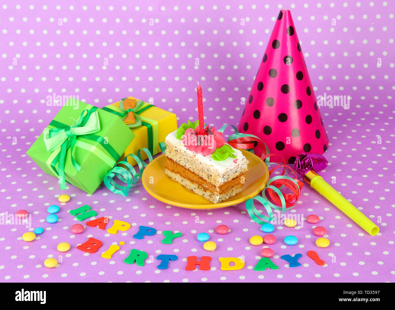 Colorful birthday cake with candle and gifts on pink background Stock ...