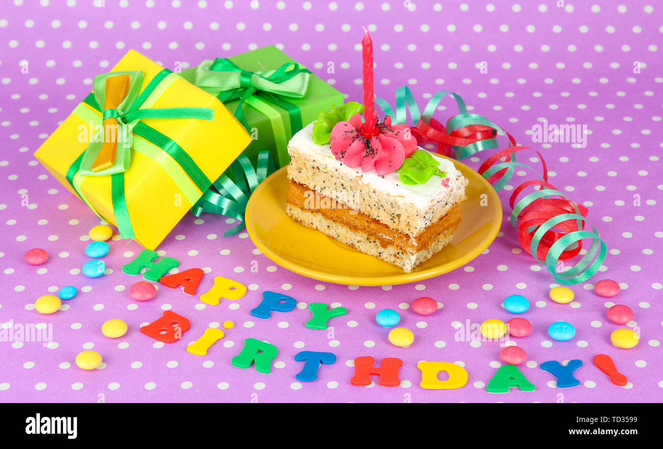 Colorful birthday cake with candle and gifts on pink background Stock ...