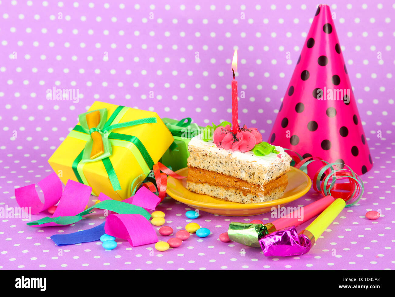 Colorful birthday cake with candle and gifts on pink background Stock ...