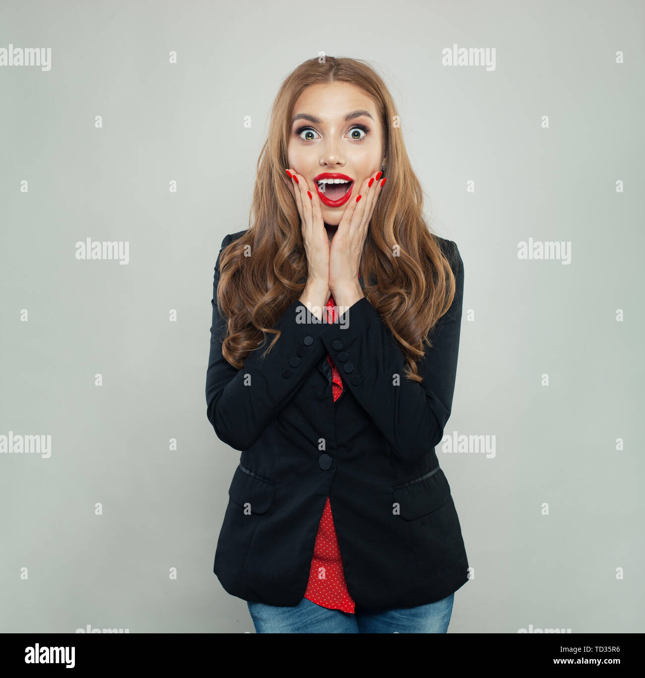 Happy surprised woman on white background Stock Photo - Alamy