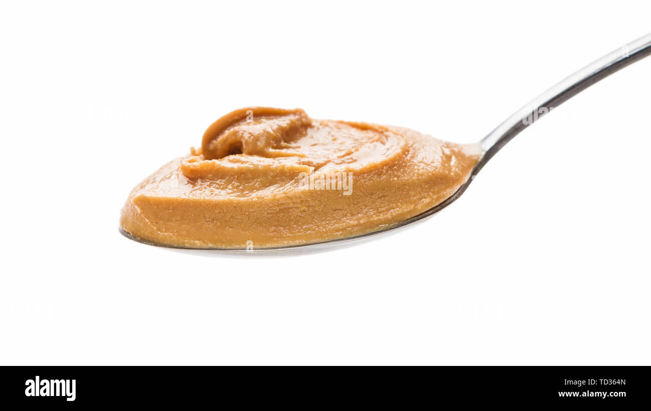 spoon of peanut paste Stock Photo - Alamy