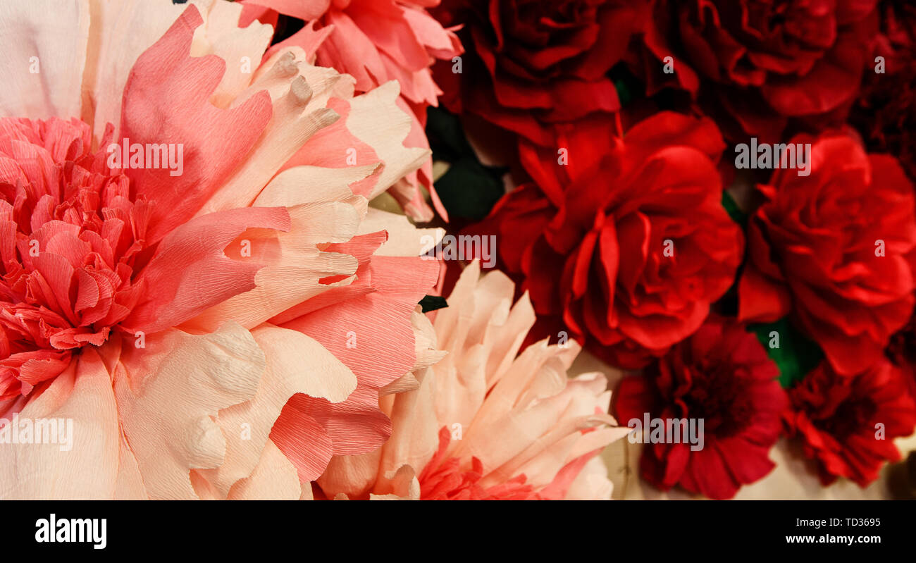 Handmade paper red and pink flowers background Stock Photo - Alamy