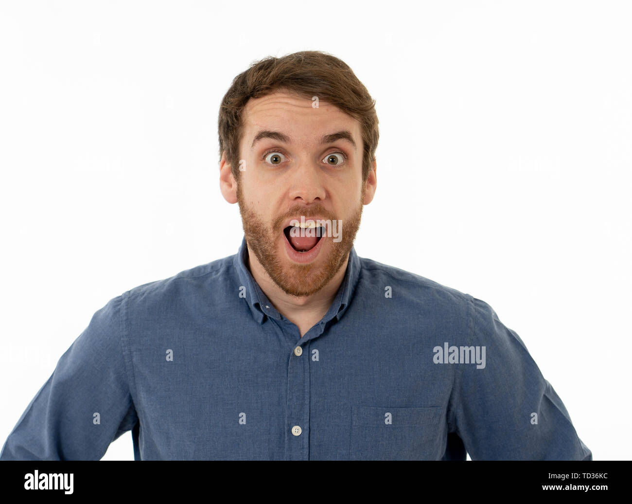 Portrait of funny attractive young man with happy and surprised face ...