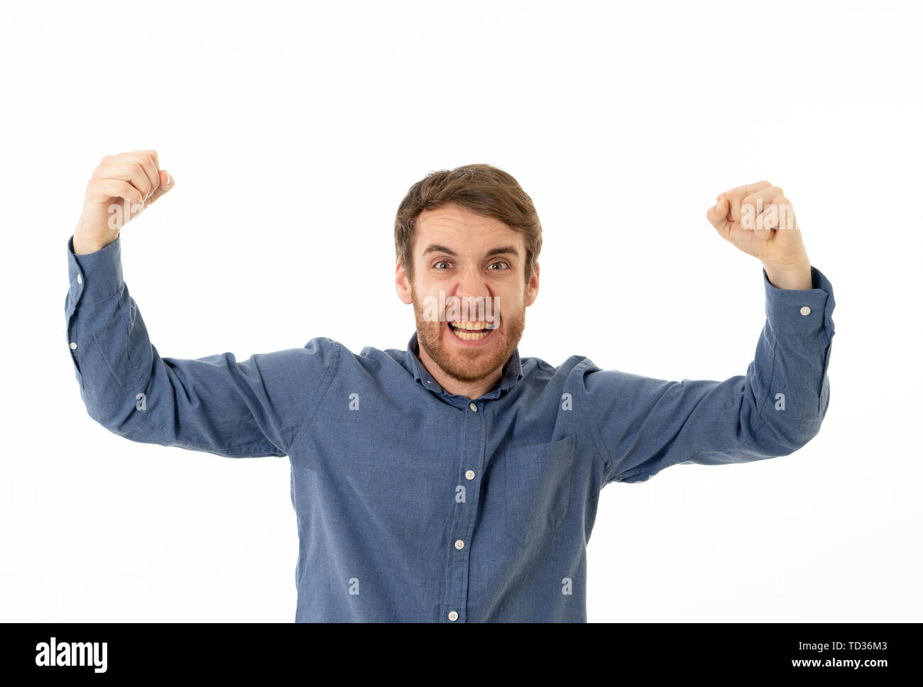 Portrait of young happy and excited man winning the lottery celebrating ...