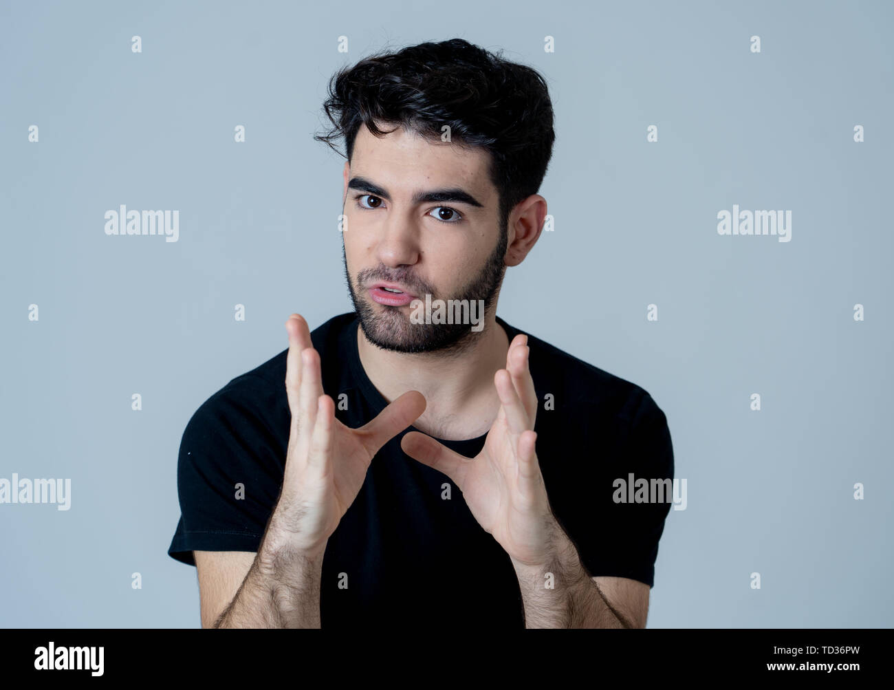 Portrait of angry and upset young man looking furious, aggressive and ...