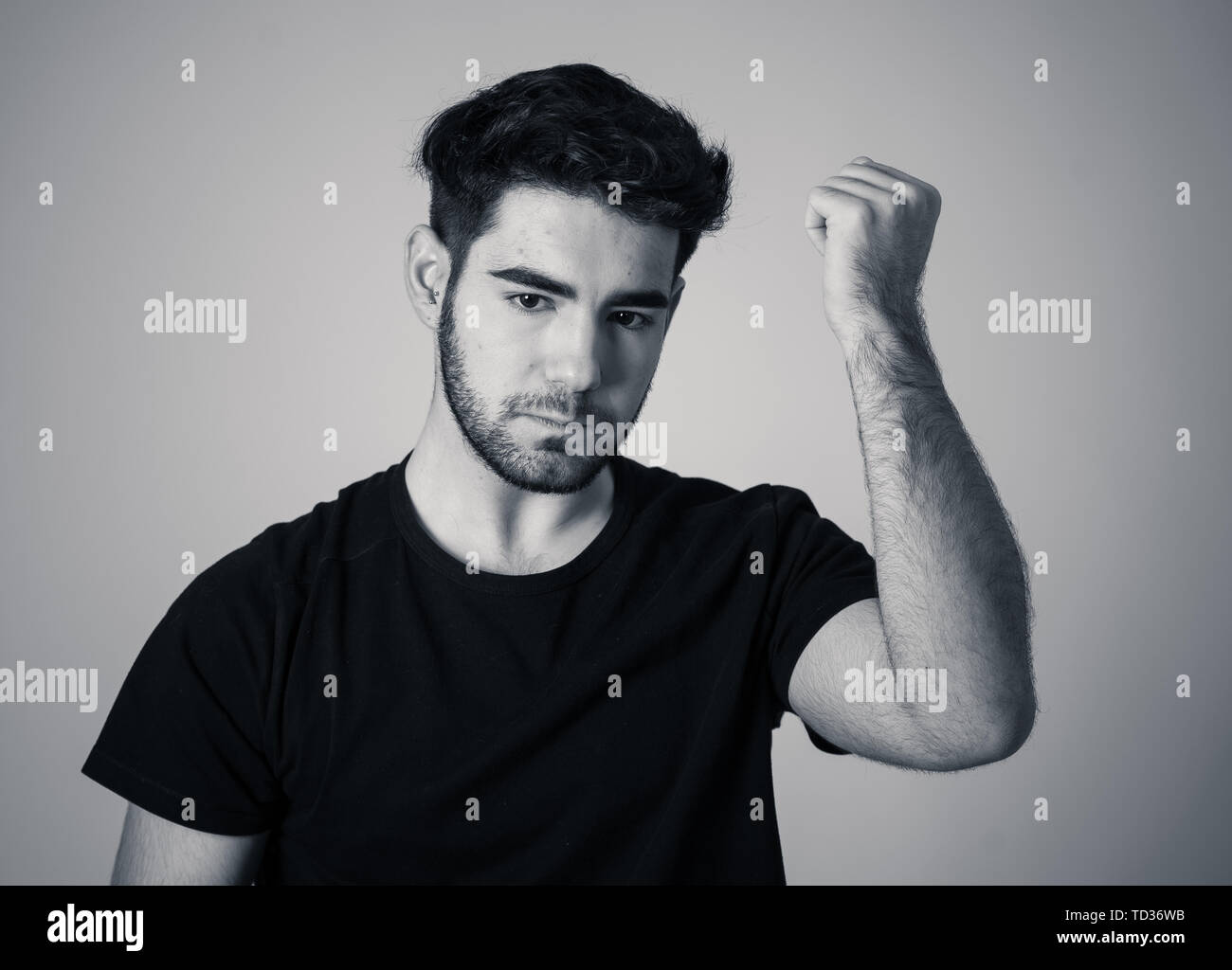 Young sad man suffering from depression looking serious and concerned ...