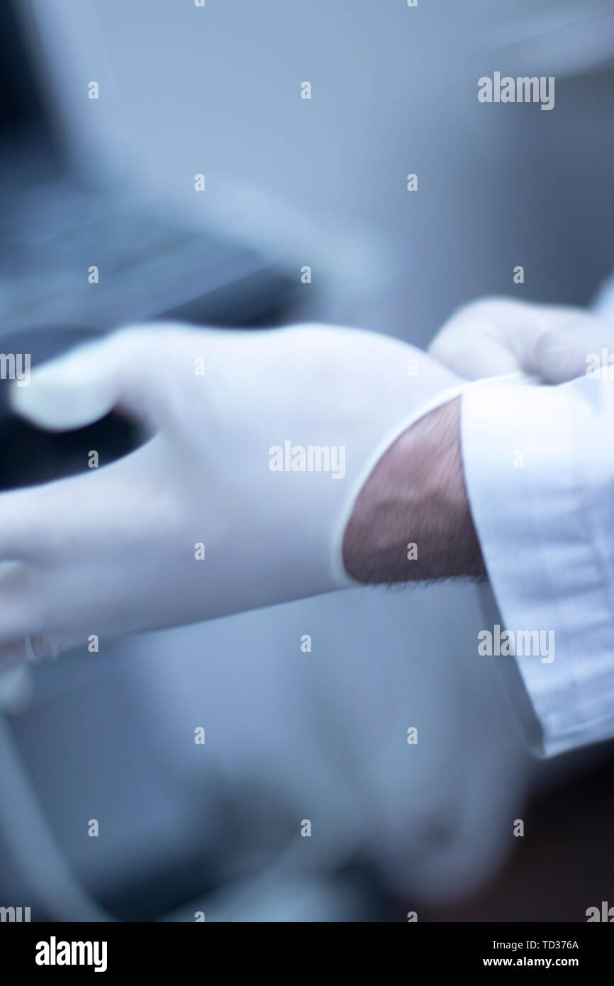 Doctor medical glove on hand in hospital clinic center Stock Photo - Alamy