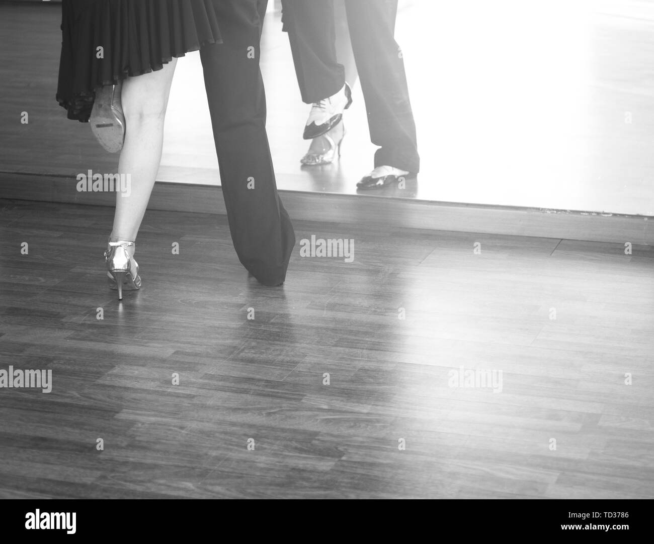 Ballroom dance couple of dancers and teachers in studio school dancing ...