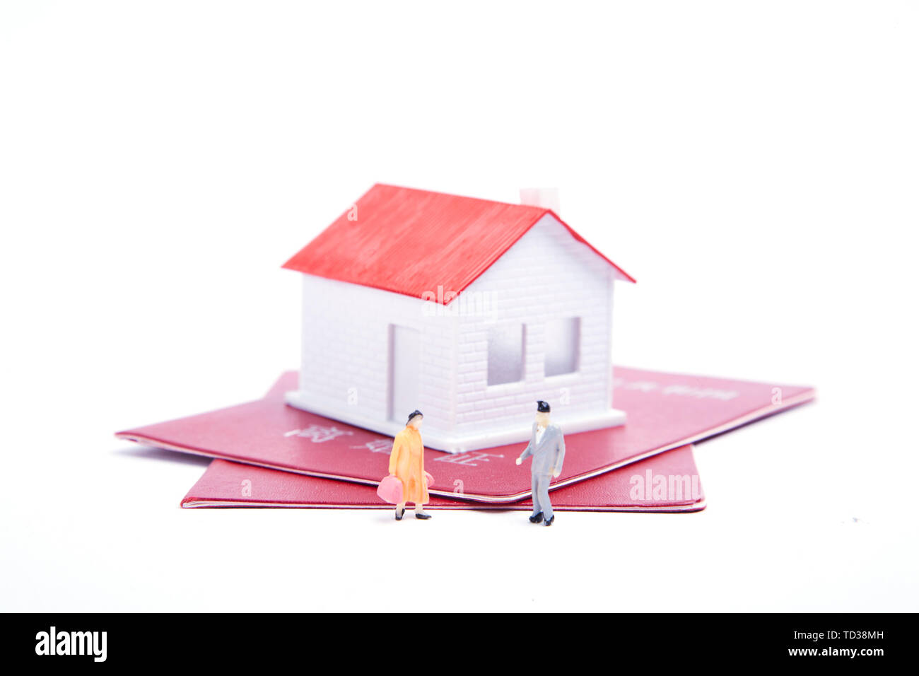 Divorce certificates and house models Stock Photo - Alamy