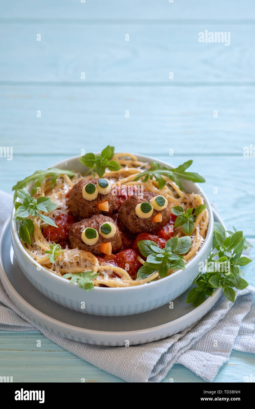 Pasta spaghetti with funny meatballs for kids. Birds in nests Stock ...