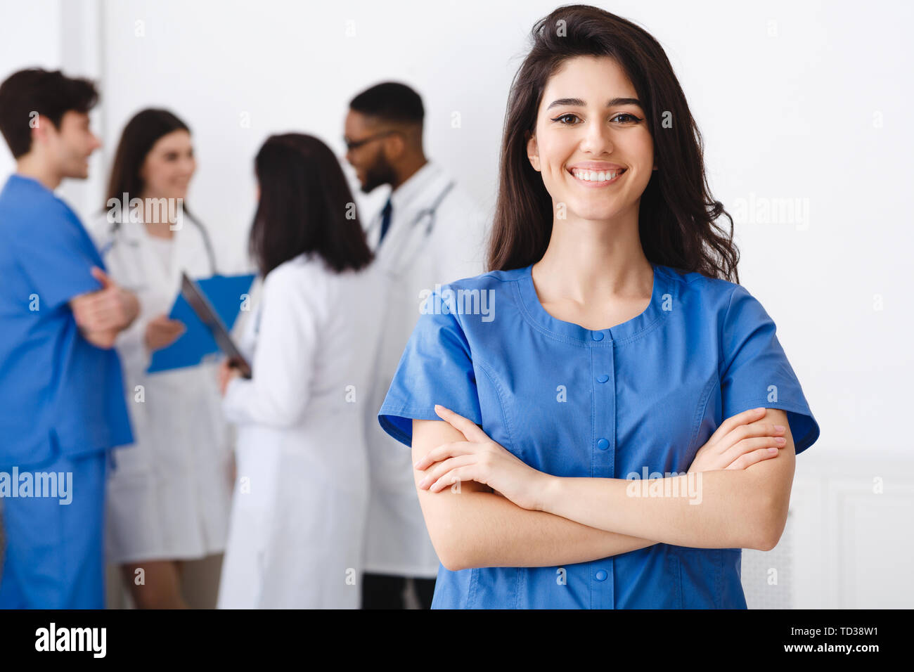 Happy Intern Posing To Camera During Conference Stock Photo - Alamy