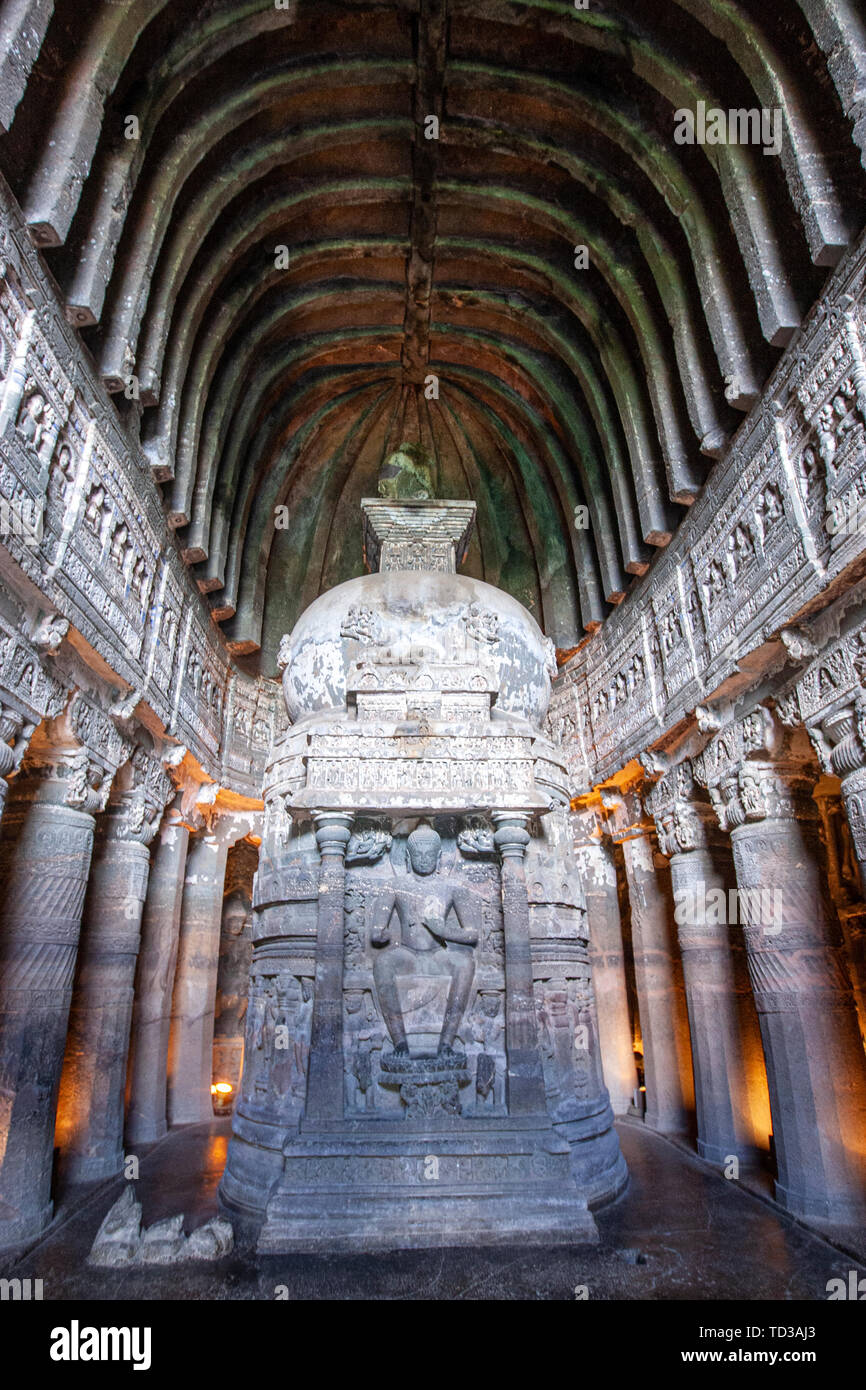 The sculptured dagoba (stupa), Buddha on its front,in the worship hall ...