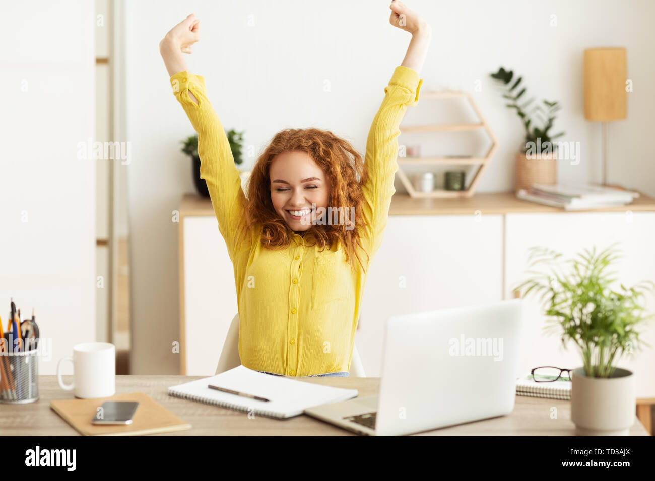 Creative Designer Stretching In Front Of Laptop Computer Stock Photo ...
