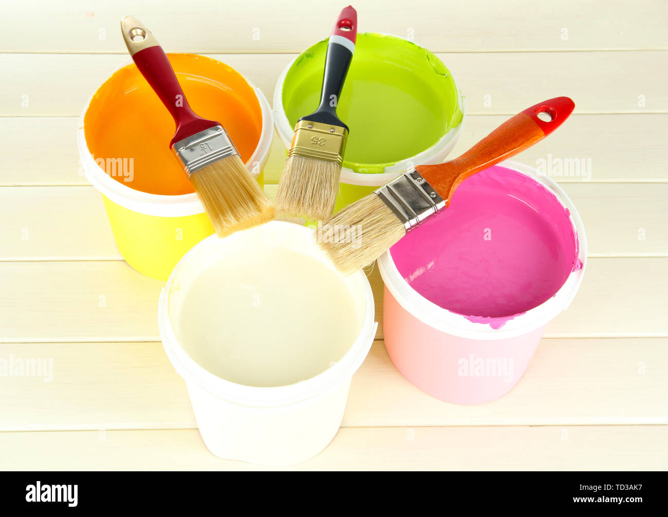 Set for painting: paint pots, brushes on white wooden table Stock Photo ...