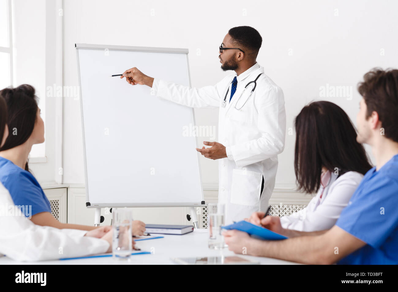 Weekly Meeting. Team Of Doctors Having Brainstorming Session Stock ...